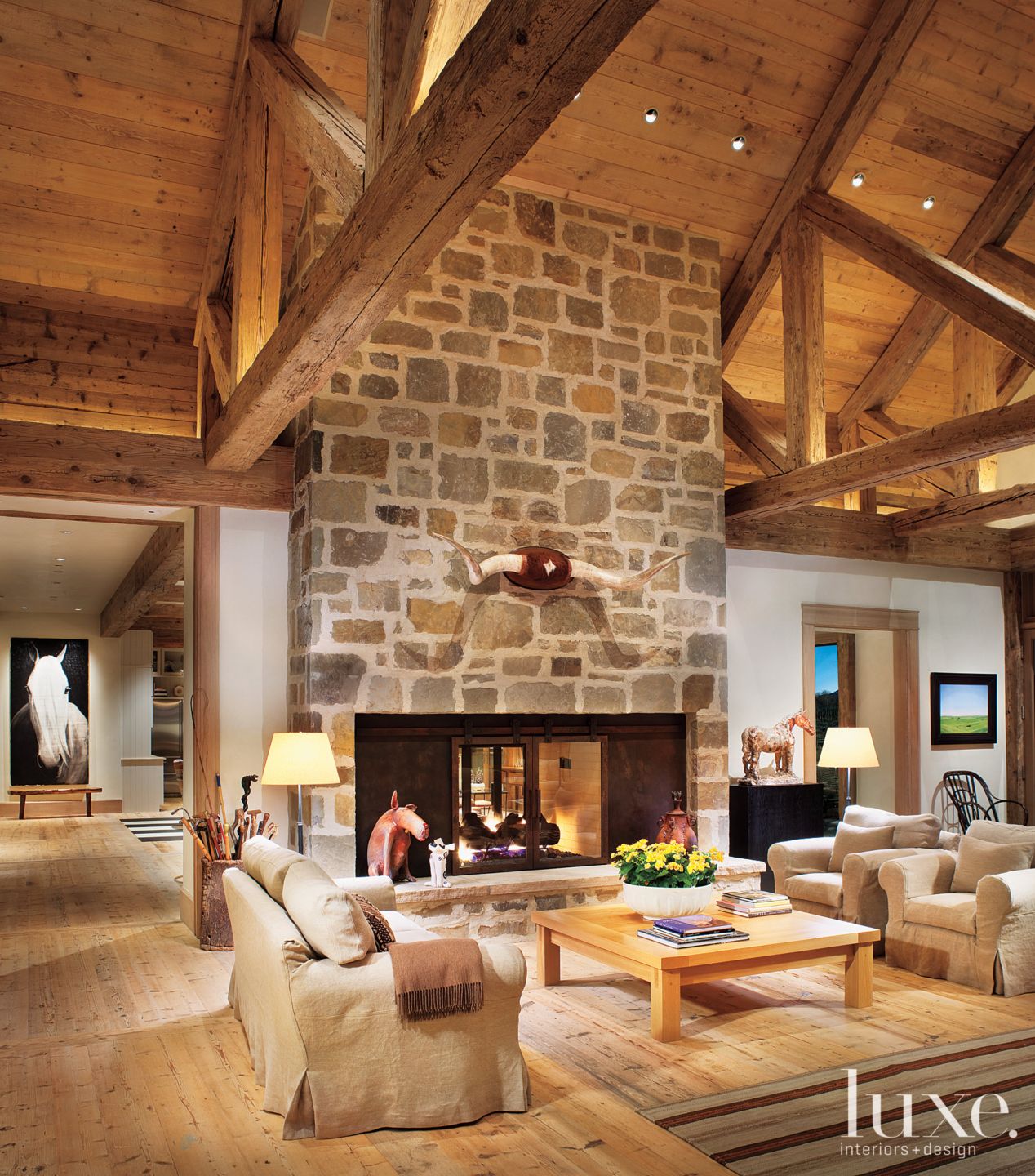 Rustic Wood Living Room with Pitched Ceiling - Luxe Interiors + Design