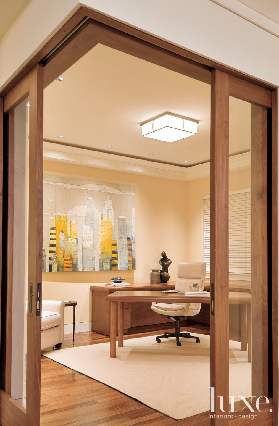 Contemporary Cream Office with Skyline Artwork - Luxe Interiors + Design