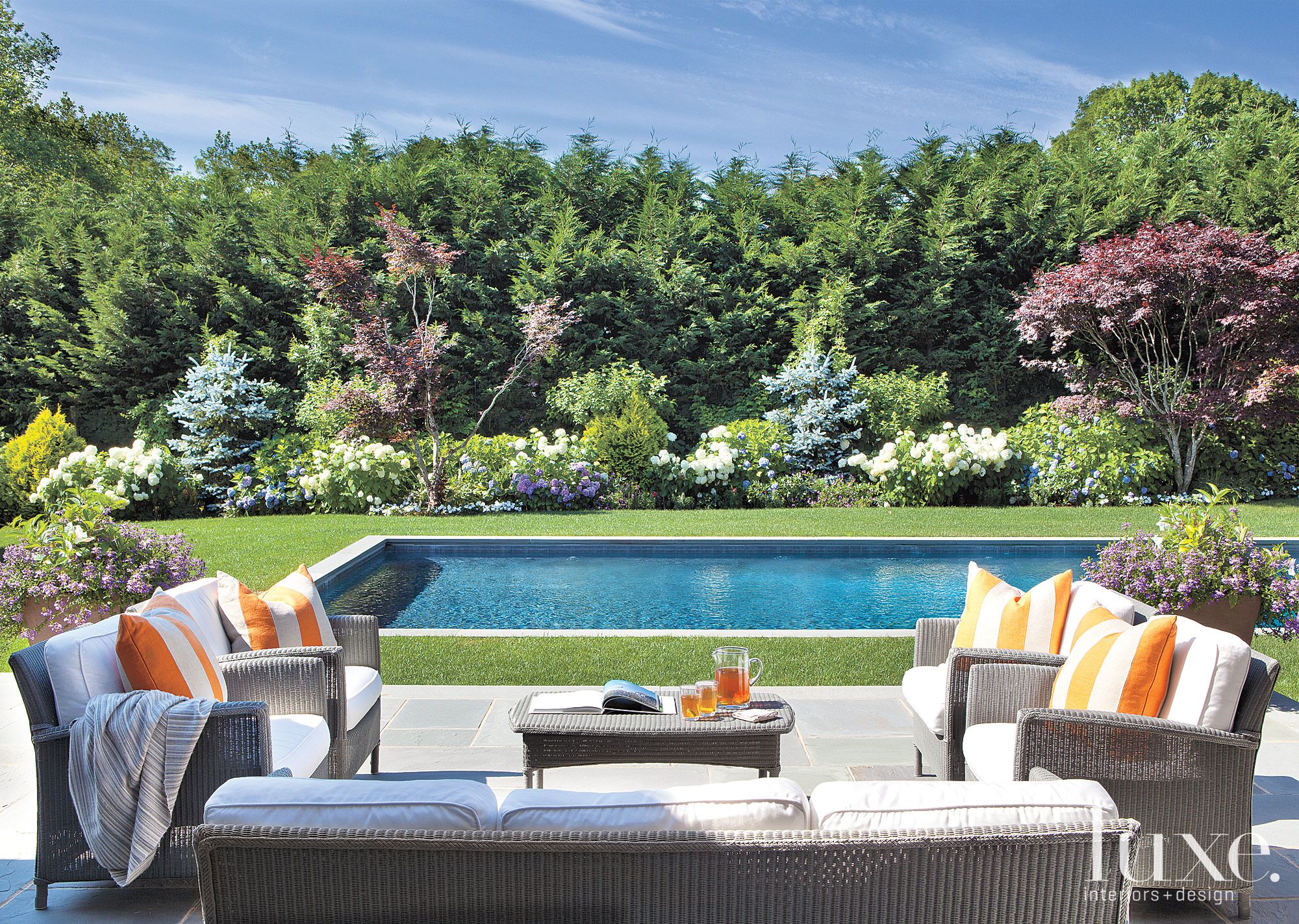 Traditional Neutral Pool Area with Lush Gardens - Luxe Interiors + Design