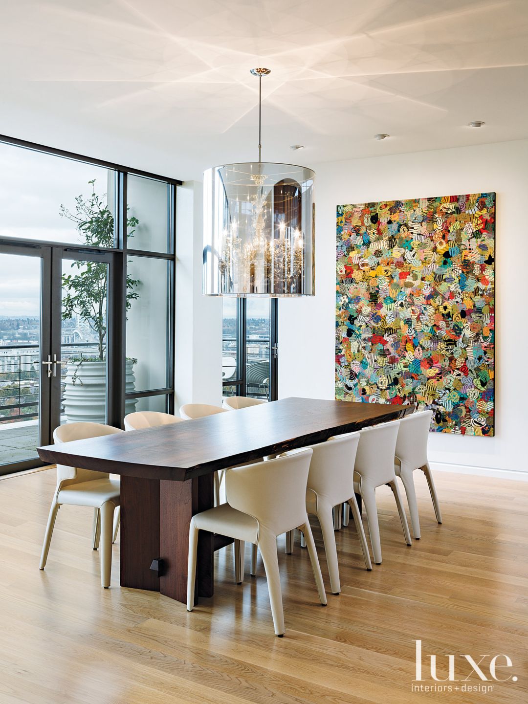 Contemporary White Dining Room with City Views - Luxe Interiors + Design