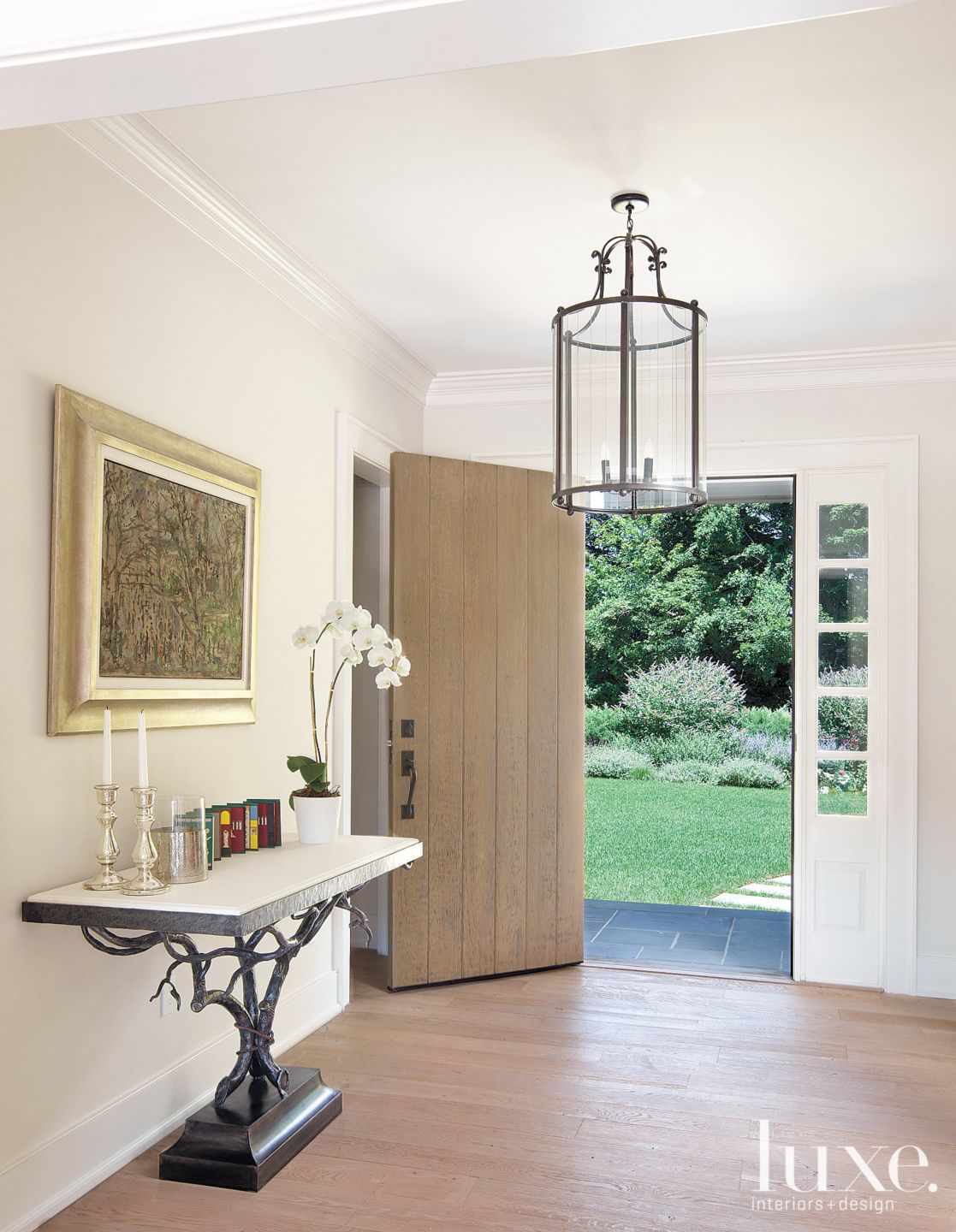 Traditional White Foyer with Sculptural Console - Luxe Interiors + Design