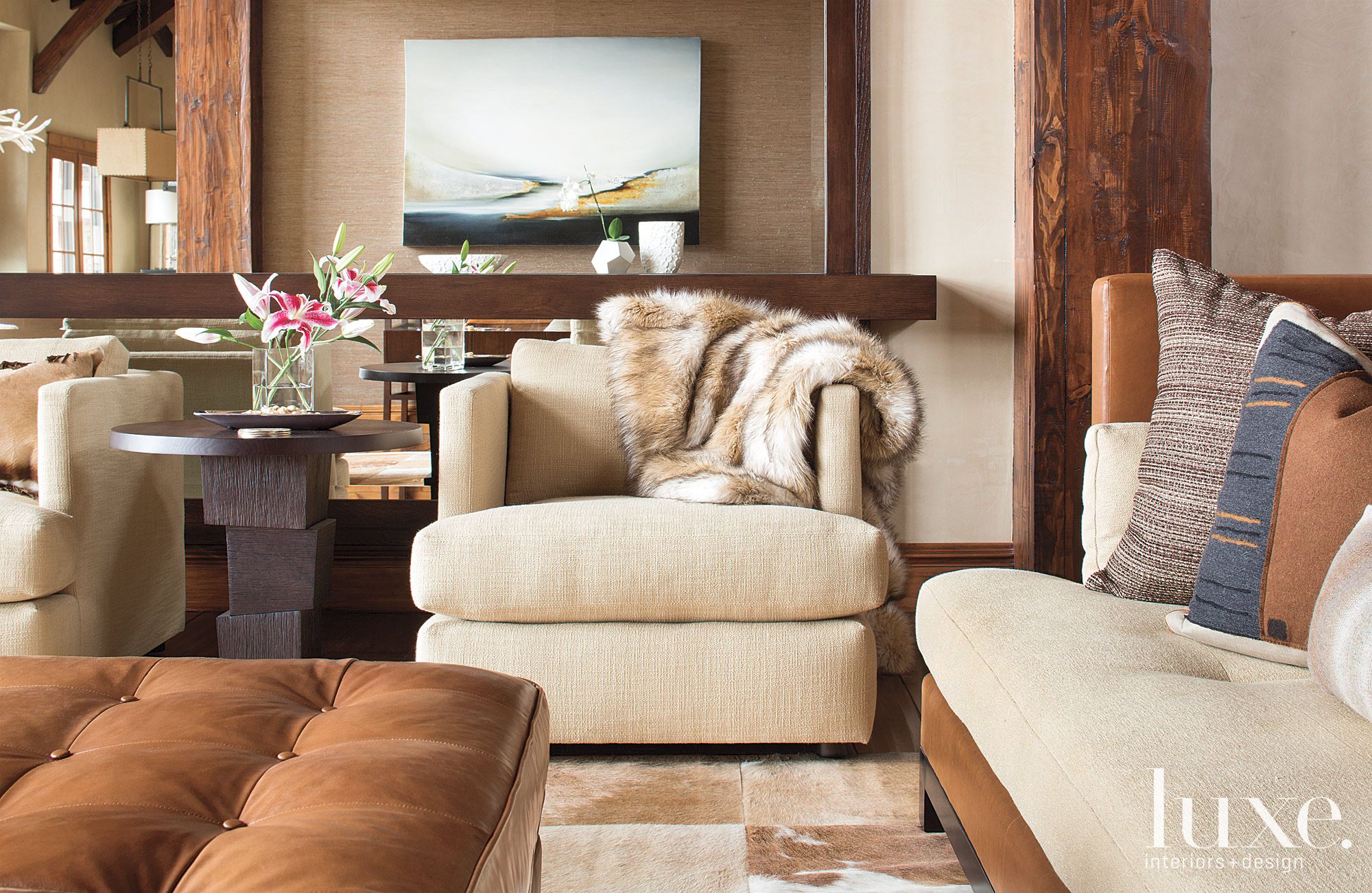 Large cream colored chair in living room - Luxe Interiors + Design