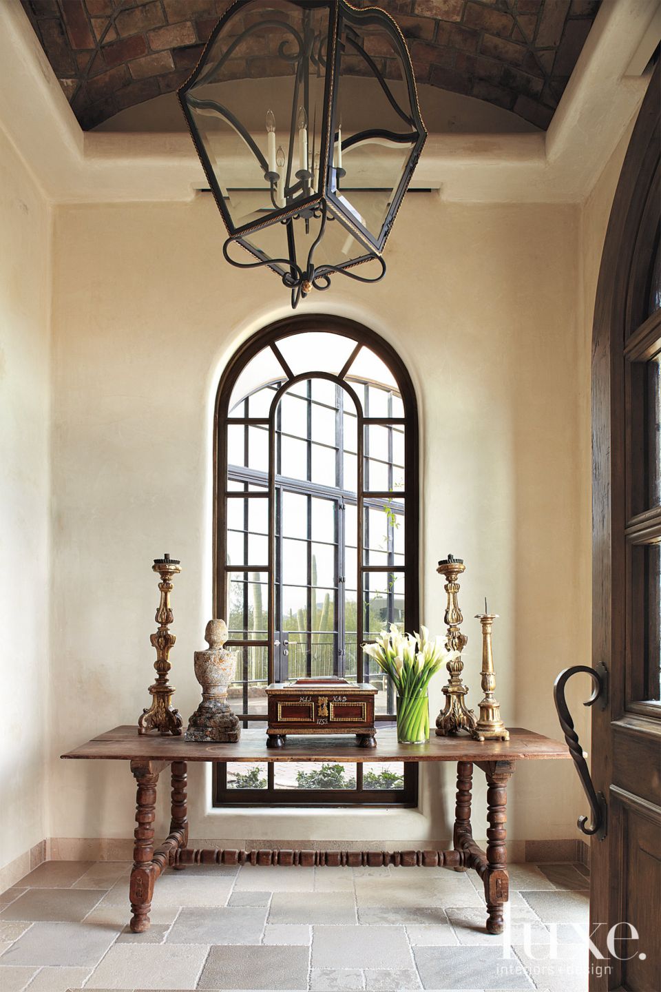 Cream Mountain Foyer with Arched Window - Luxe Interiors + Design