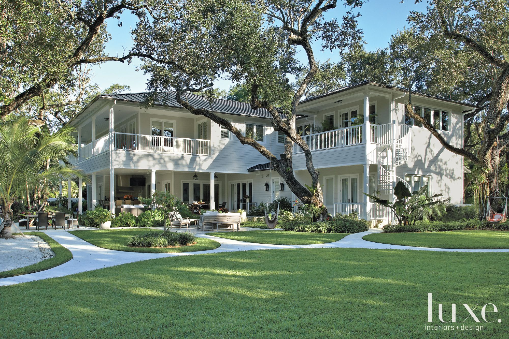 Transitional Gray Exterior with Balconies - Luxe Interiors + Design