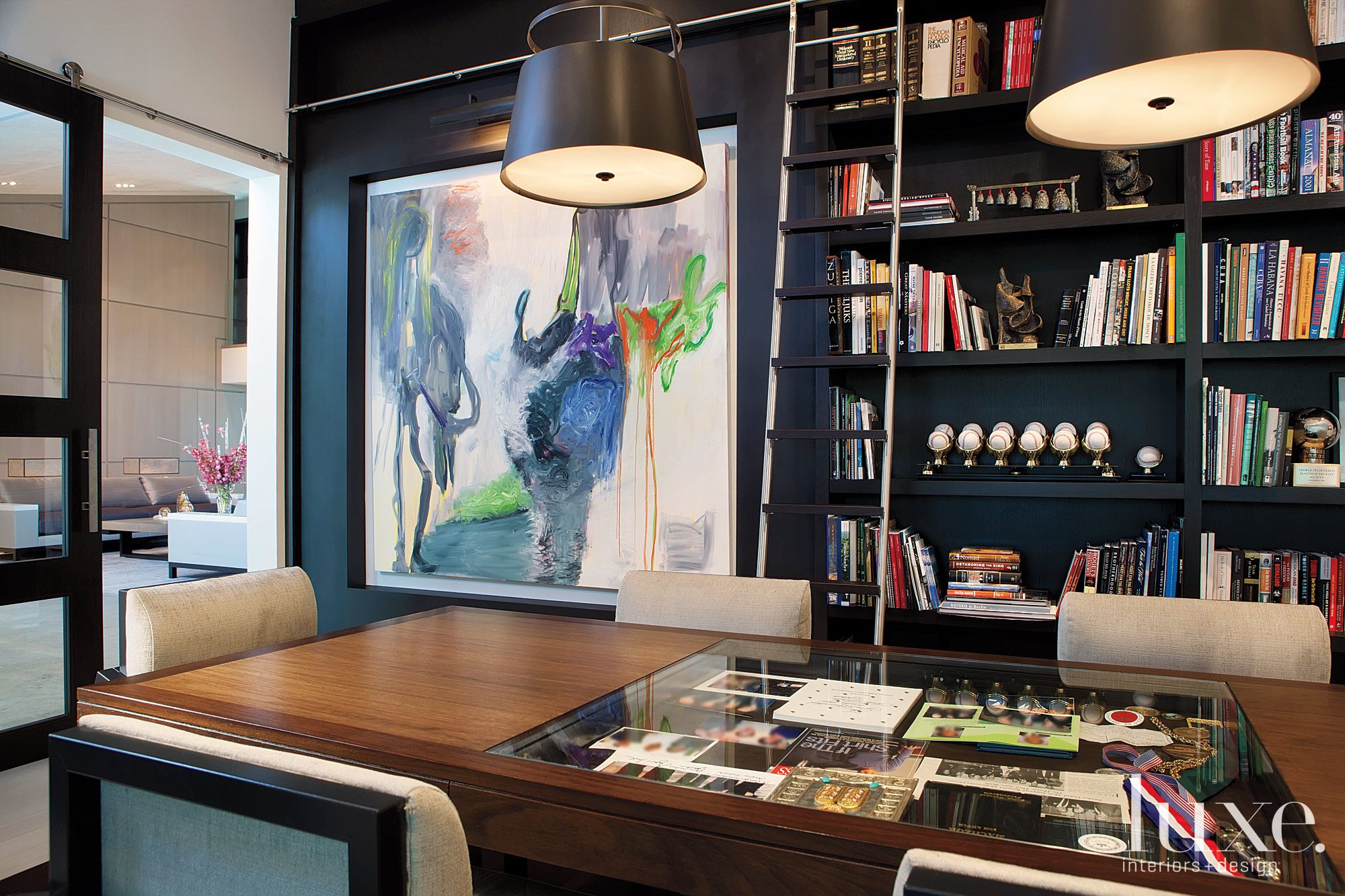 See-Through Desk in a Modern Black Study - Luxe Interiors + Design