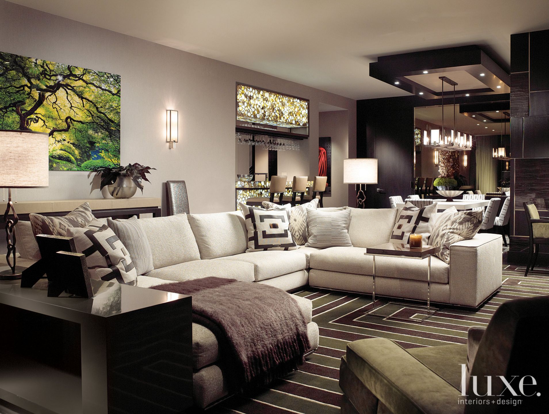 Neutral colored living room with geometric patterned rug - Luxe ...