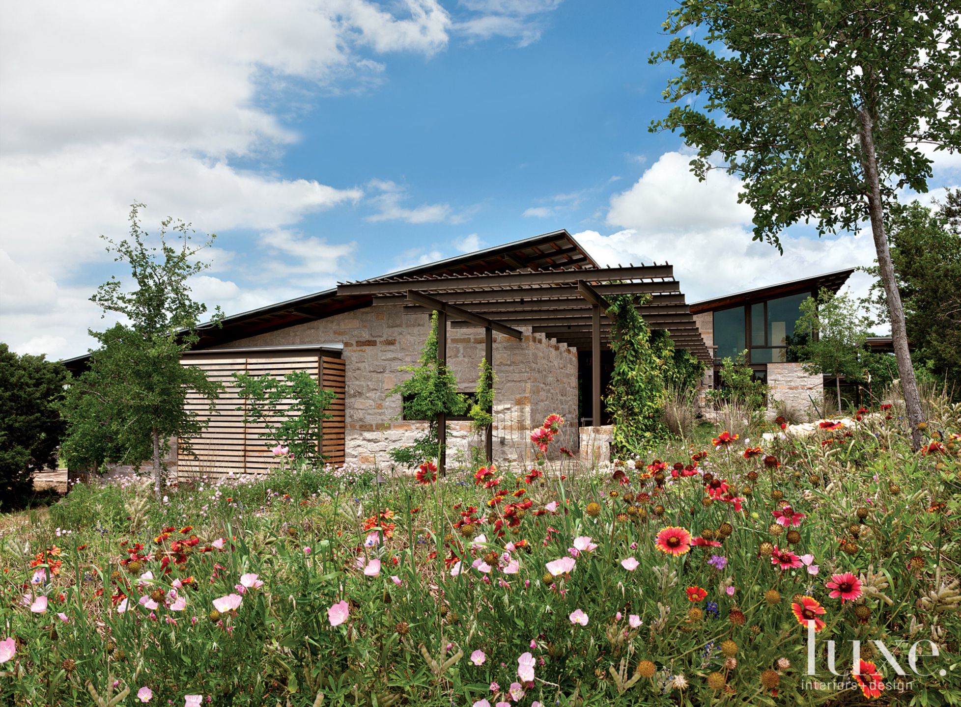 Modern Stone Exterior with Natural Landscape - Luxe Interiors + Design