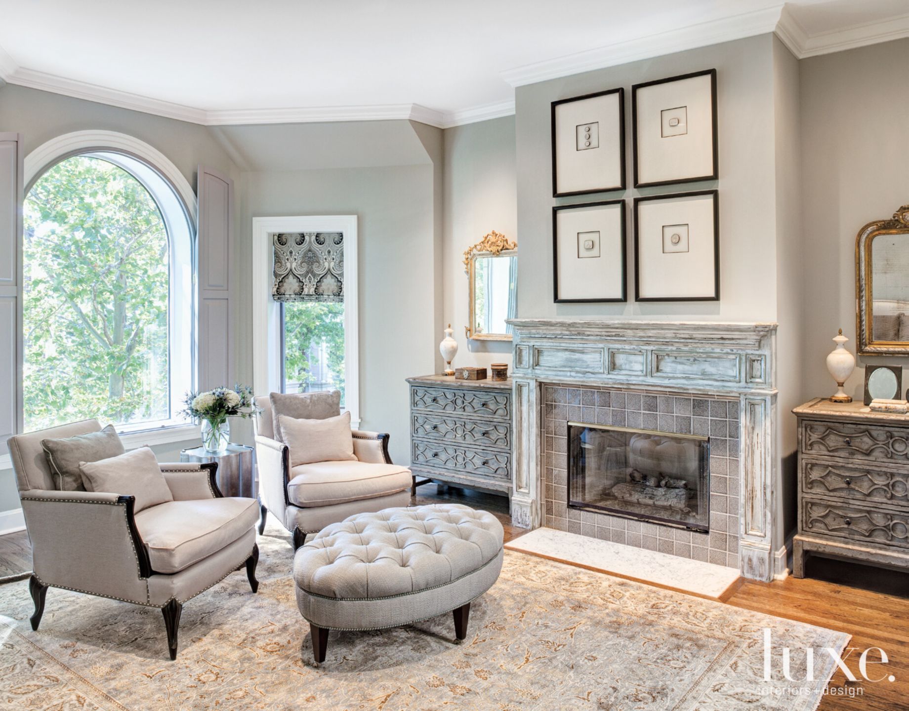 Eclectic Gray Sitting Area with Arched Window - Luxe Interiors + Design