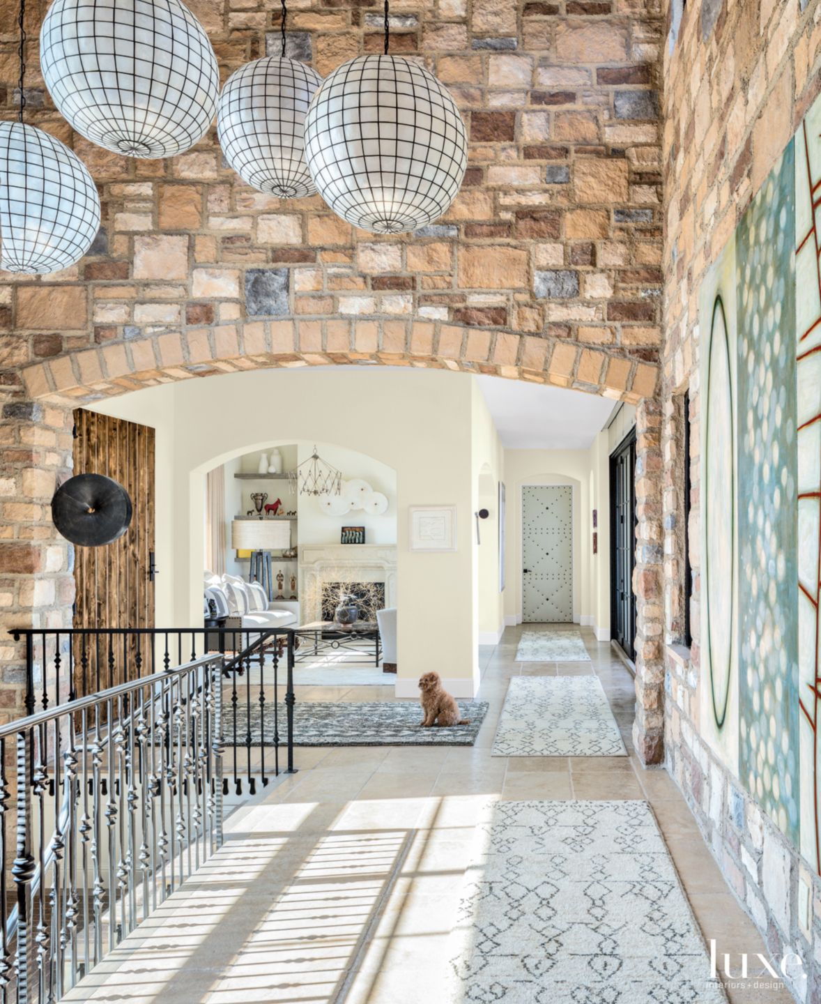 Transitional Neutral Entry with Stone Structure - Luxe Interiors + Design