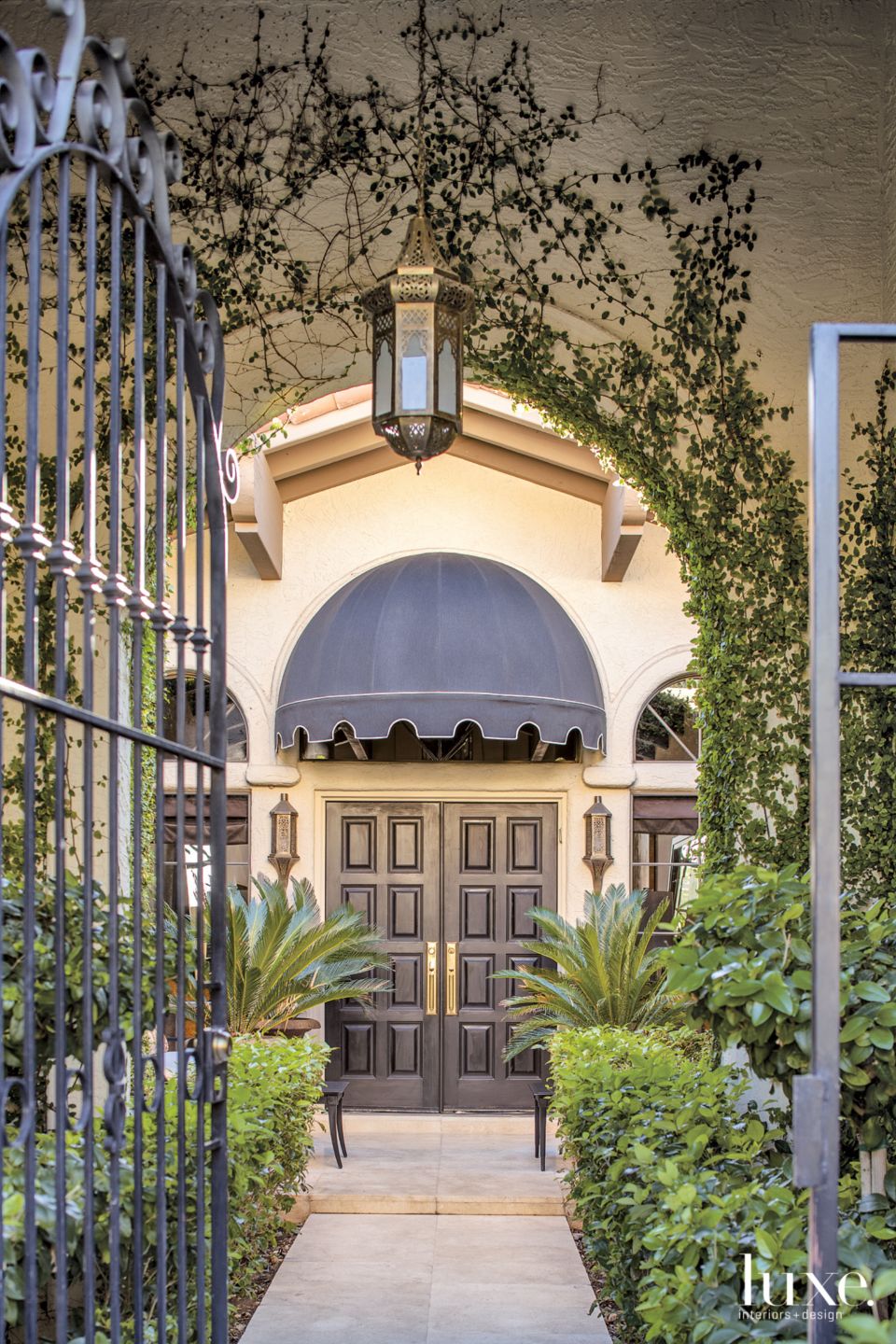 Transitional Neutral Front Courtyard with Awning - Luxe Interiors + Design