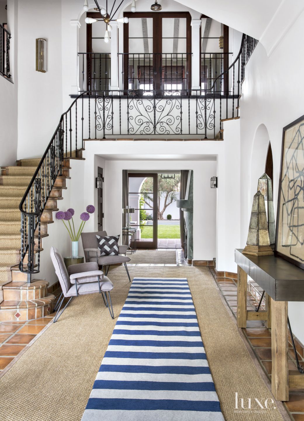 Spanish Colonial Neutral Entry with Purple Chairs - Luxe Interiors + Design