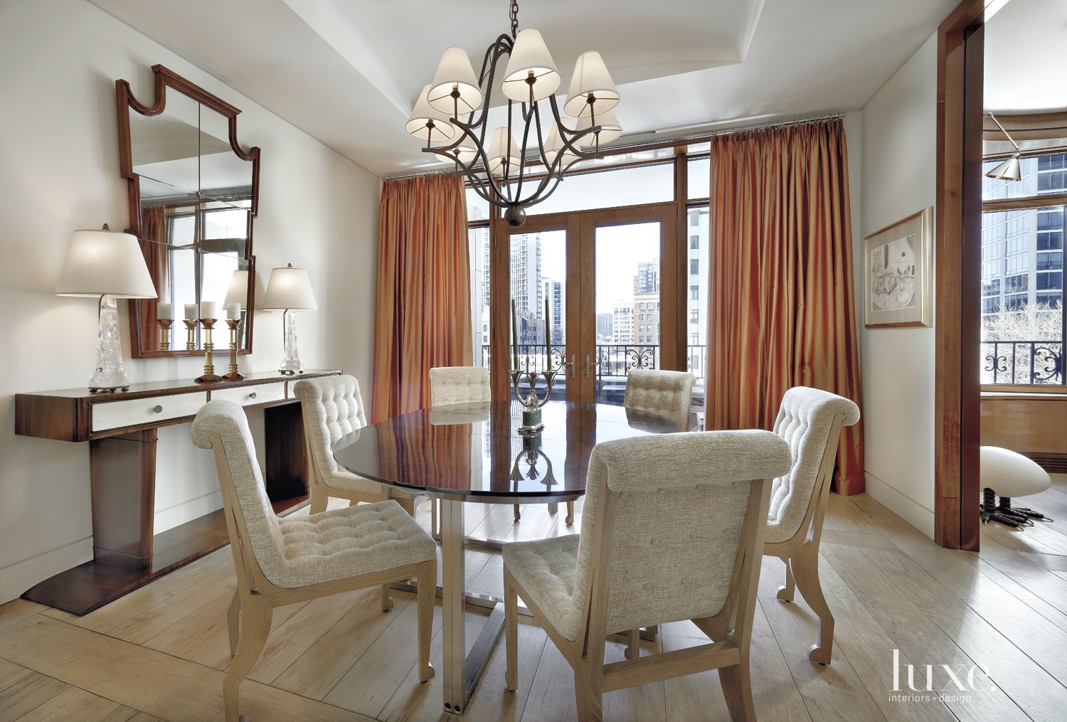 Contemporary White Dining Room with City View - Luxe Interiors + Design