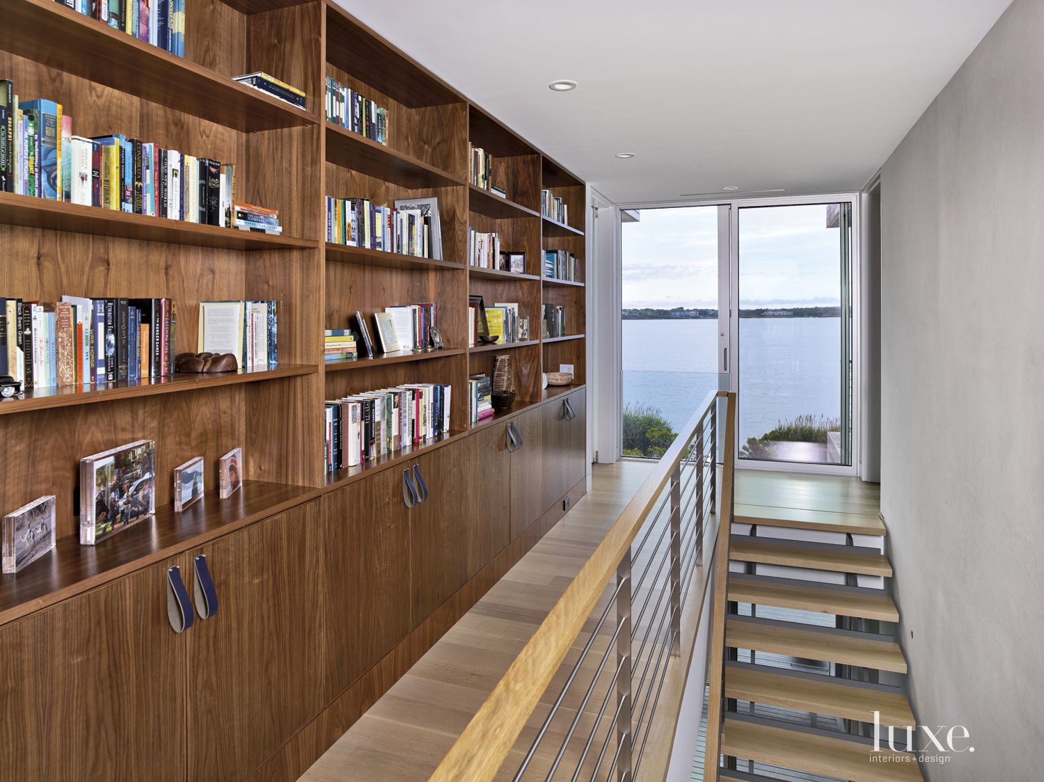 Modern White Hall with Custom Walnut Cabinetry - Luxe Interiors + Design