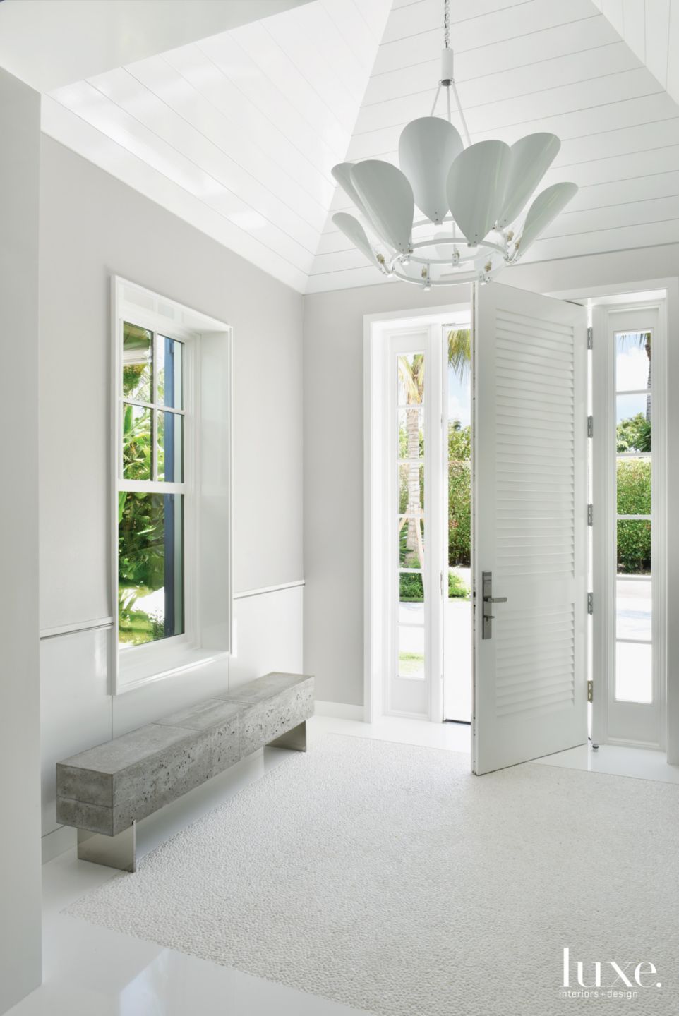 Contemporary White Entry with Custom Door - Luxe Interiors + Design