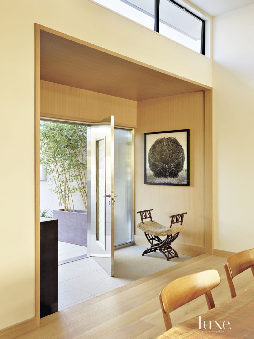Contemporary Cream Foyer with Stainless-Steel Door - Luxe Interiors ...