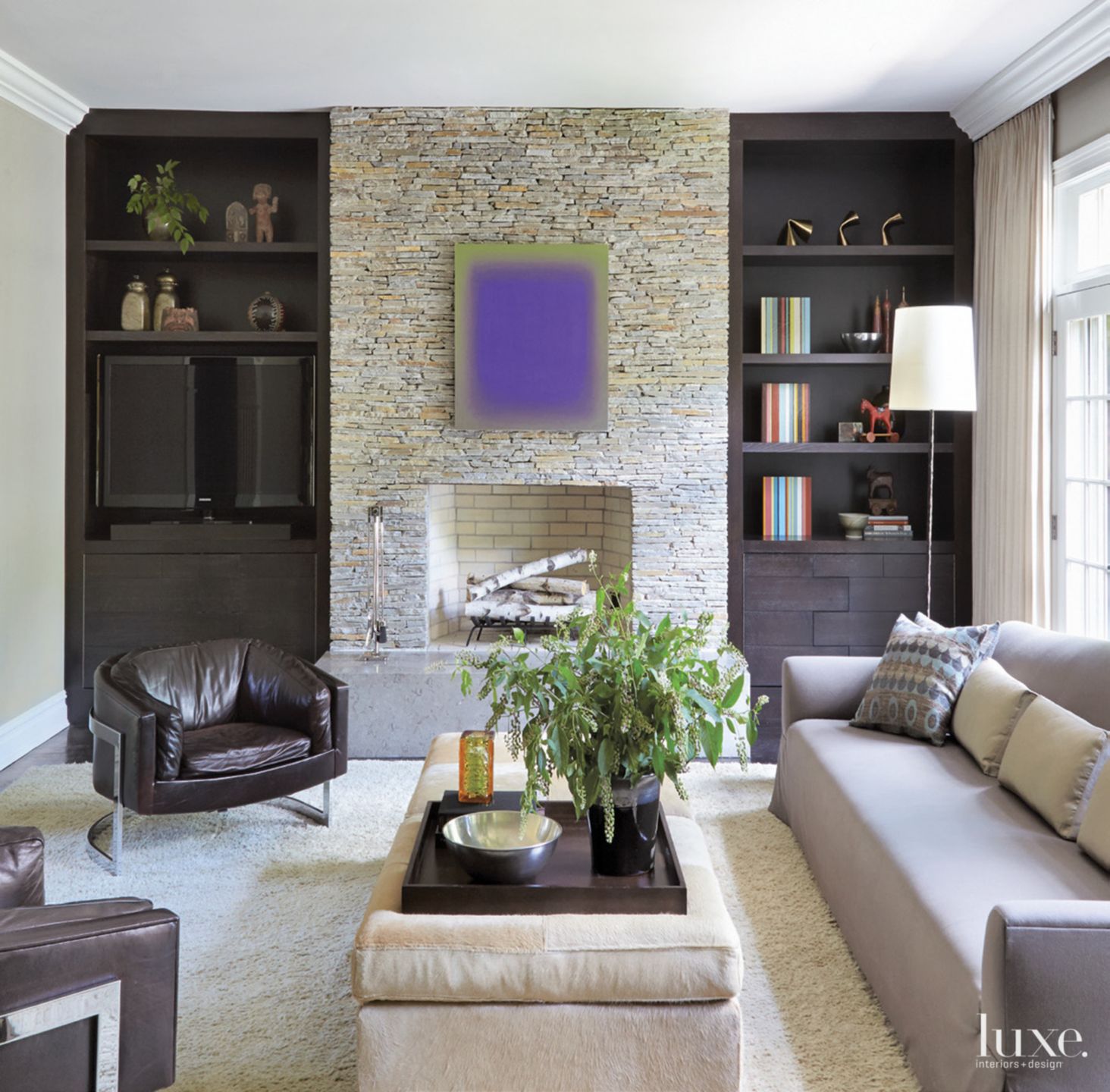 Traditional Neutral Den with Violet-Hued Artwork - Luxe Interiors + Design