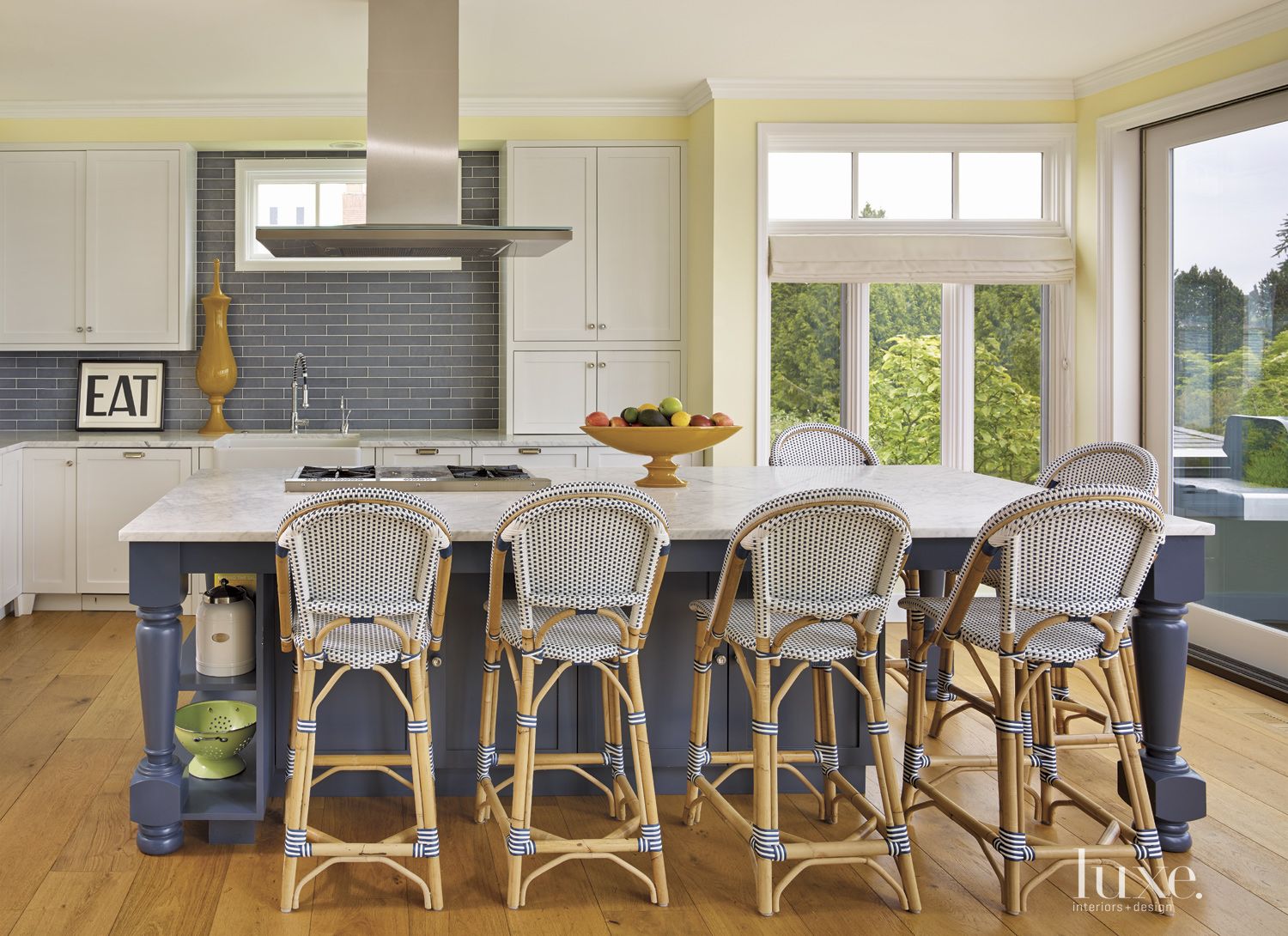 Contemporary Yellow Kitchen with Wicker Stools - Luxe Interiors + Design