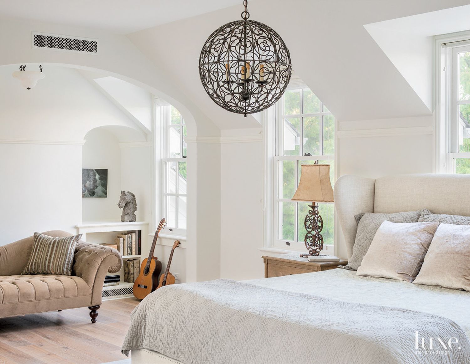 Traditional Cream Master Bedroom with Wrought-Iron Chandelier - Luxe ...