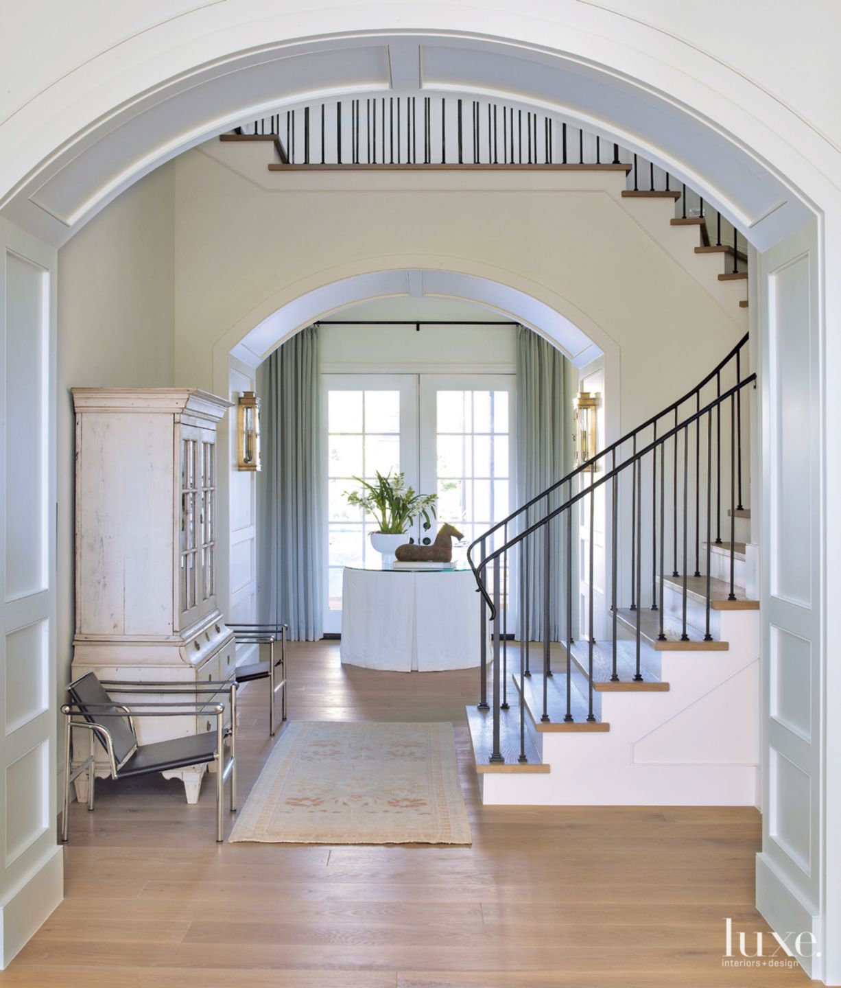 Transitional White Paneled Foyer - Luxe Interiors + Design